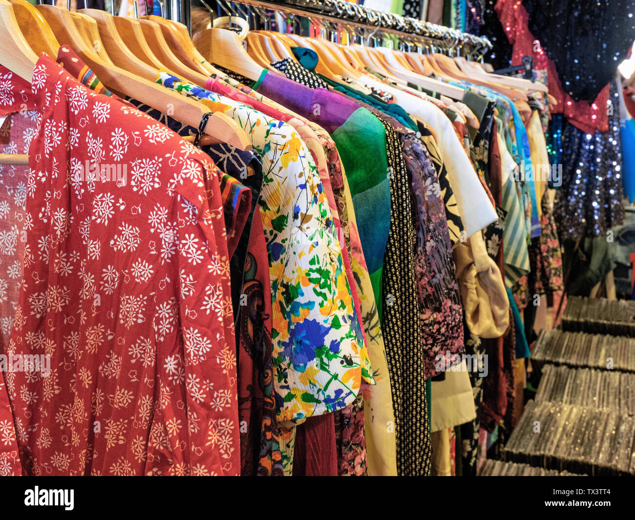 Milan - Italy. Display of brightly colored women's clothes at the flea ...