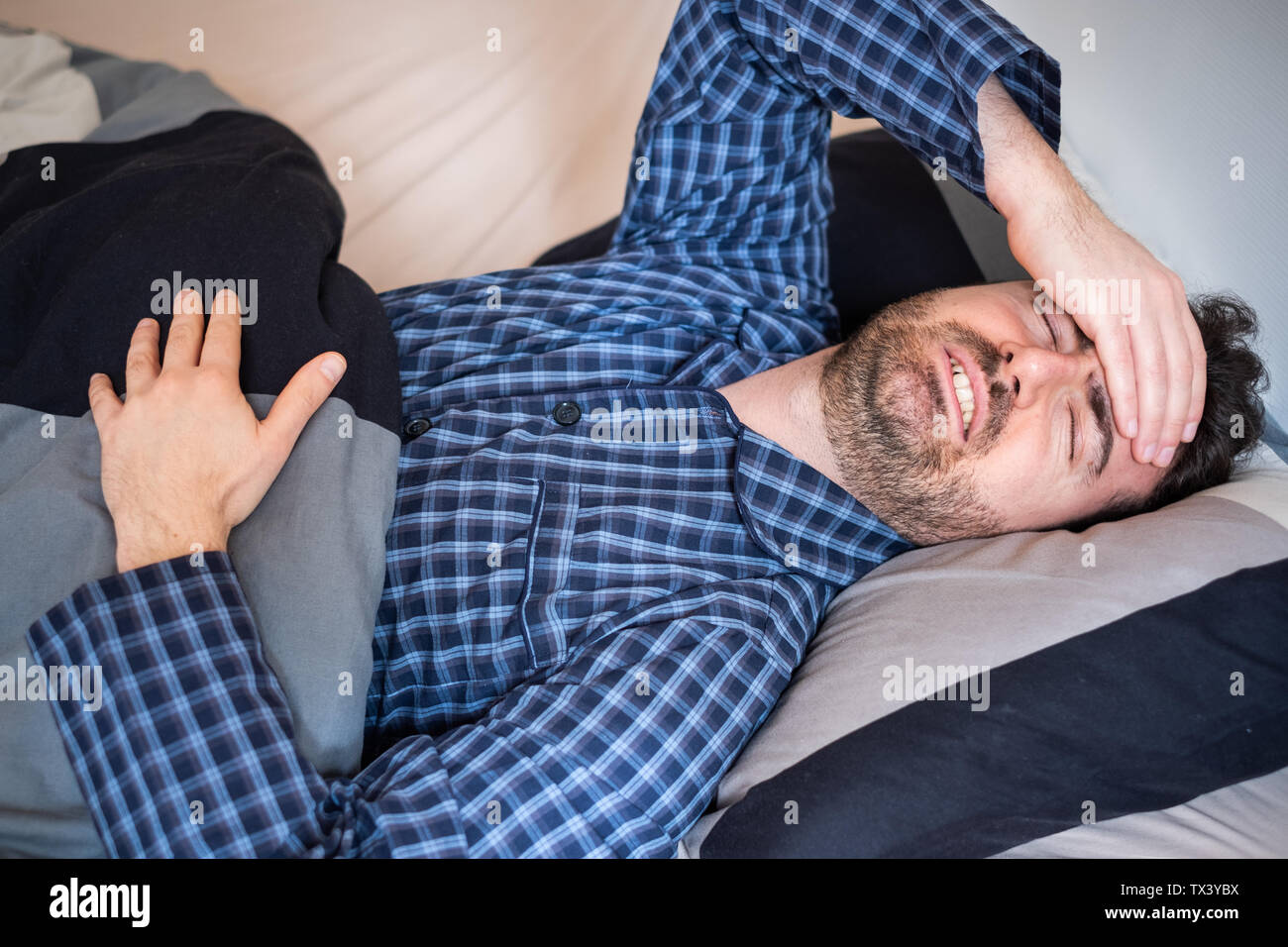 Sick man in bed hi-res stock photography and images - Alamy