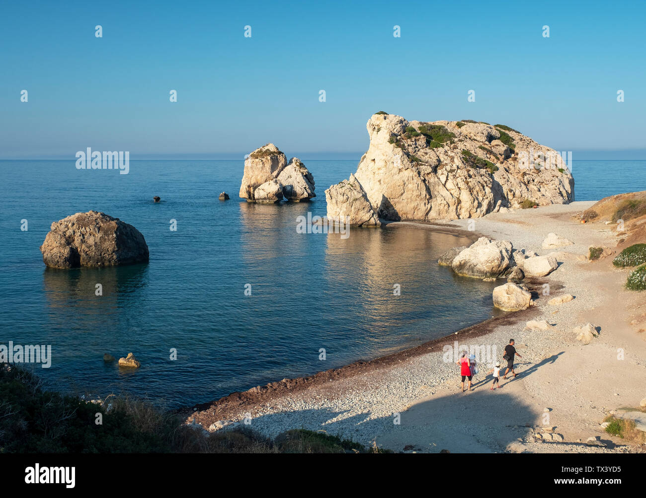 Early morning sunshine illuminates Aphrodite's Rock (Petra Tou Romiou ...