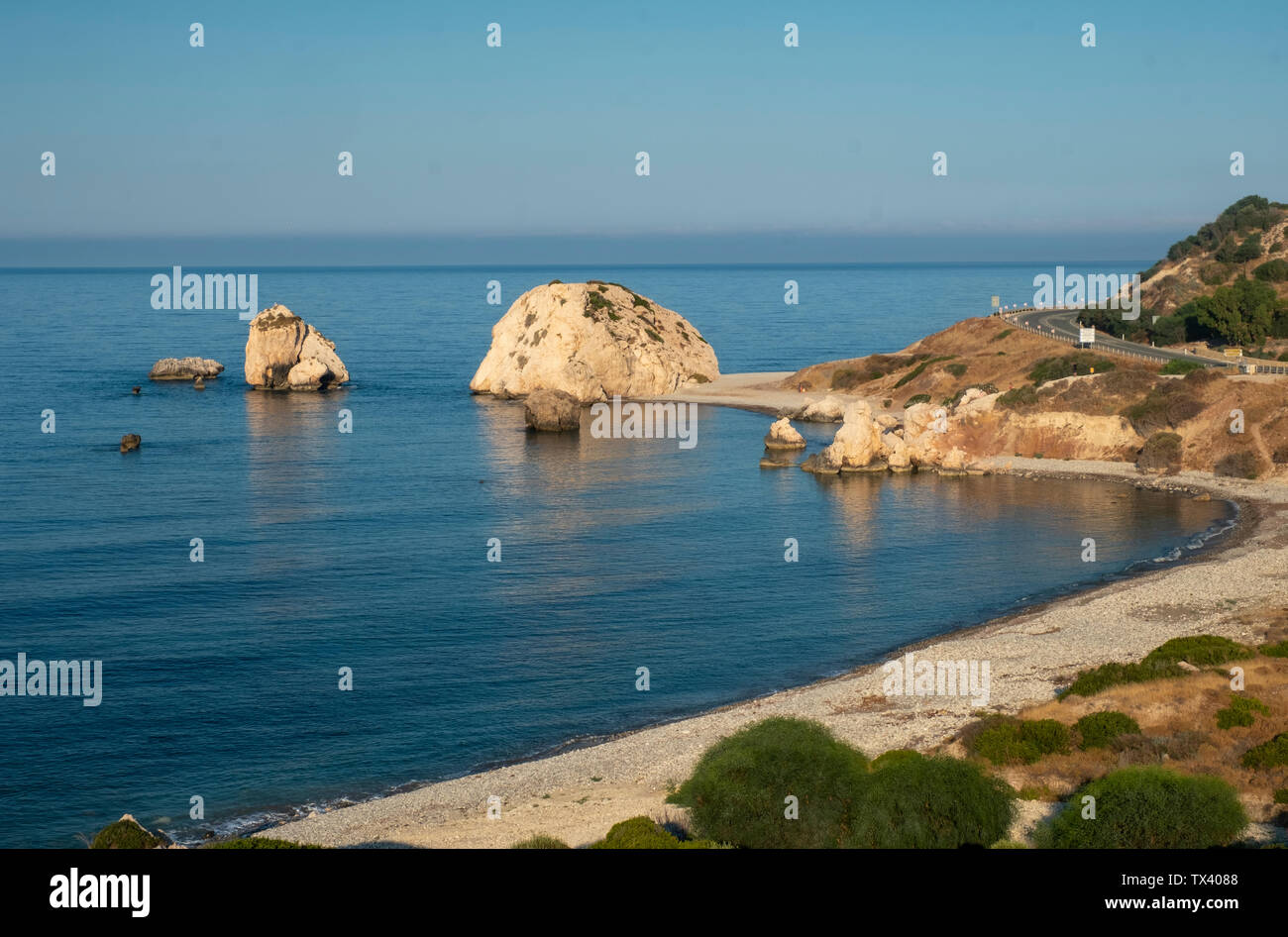 Early morning sunshine illuminates Aphrodite's Rock (Petra Tou Romiou ...