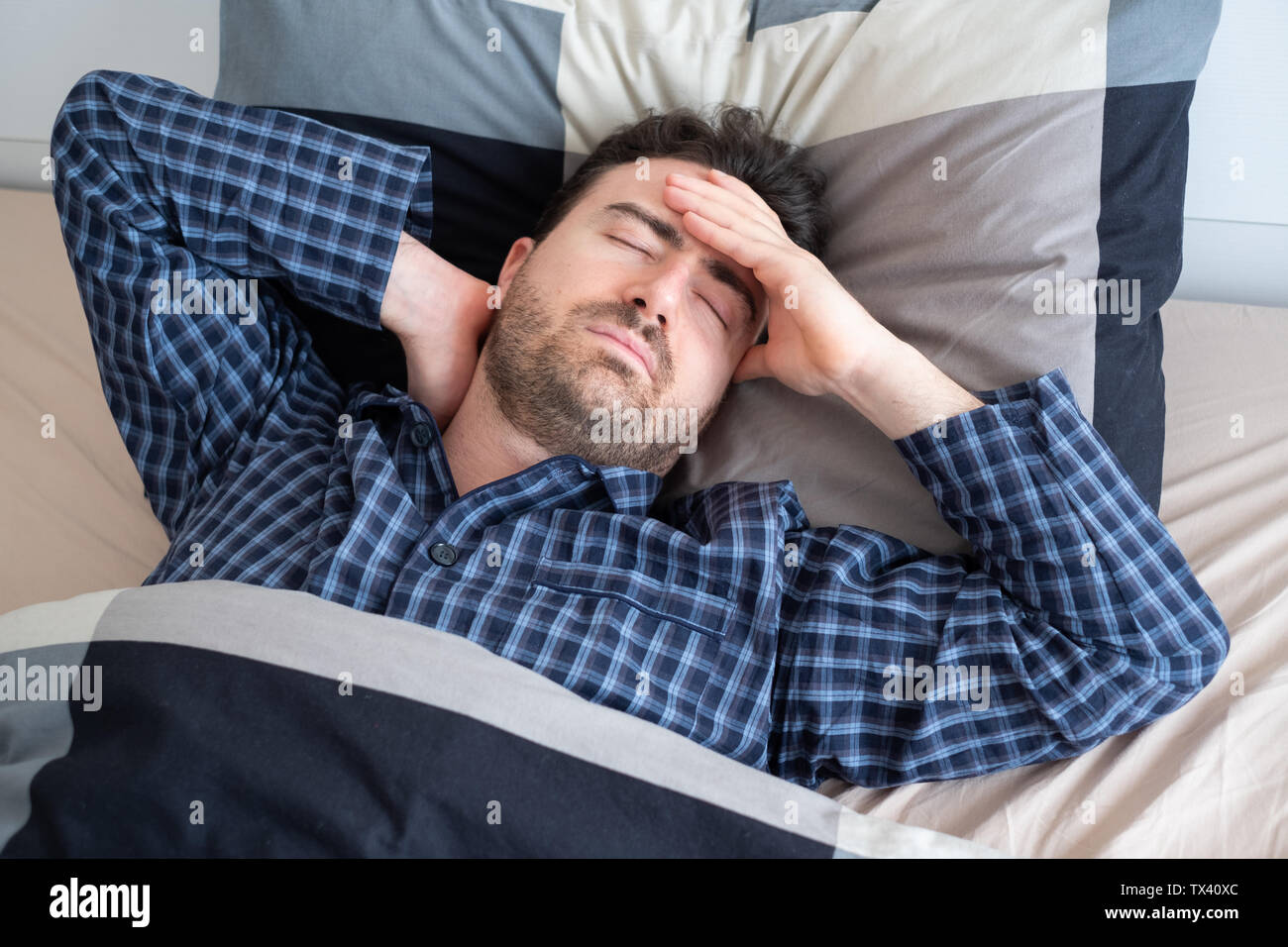 Man headache touching forehead hi-res stock photography and images - Alamy