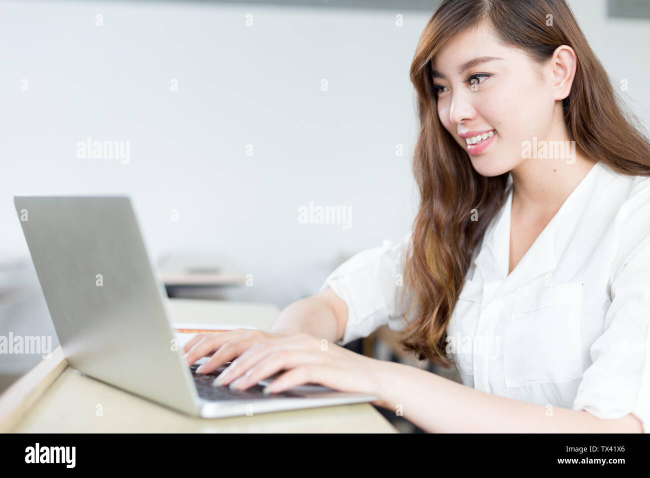 Asian beautiful female student study with laptop in classroom Stock ...