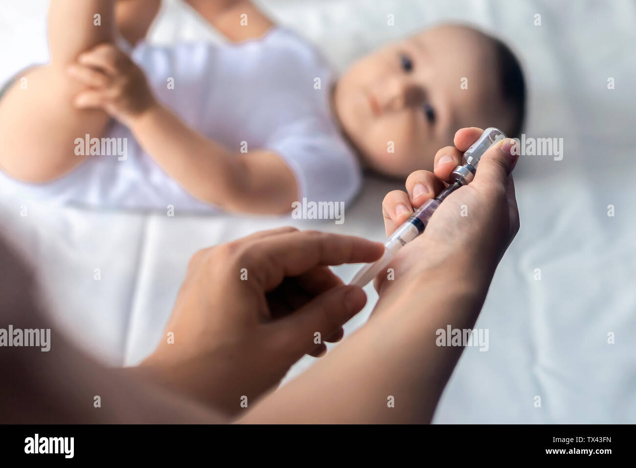Doctor vaccinating a newborn baby boy. Child's Immunization, Children's ...