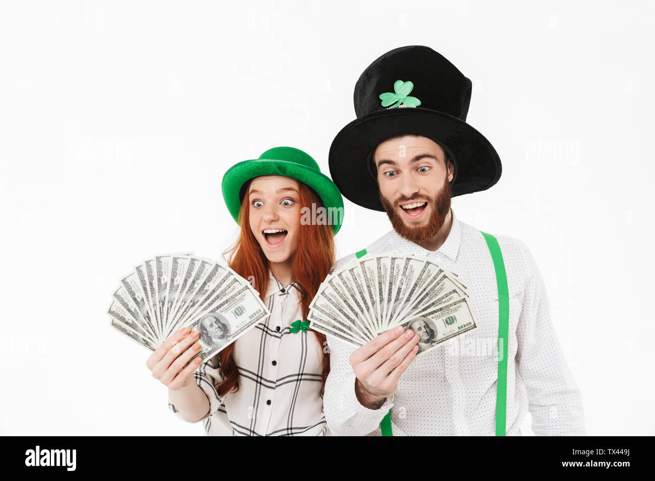 Happy young couple wearing costumes, celebrating St.Patrick 's Day ...