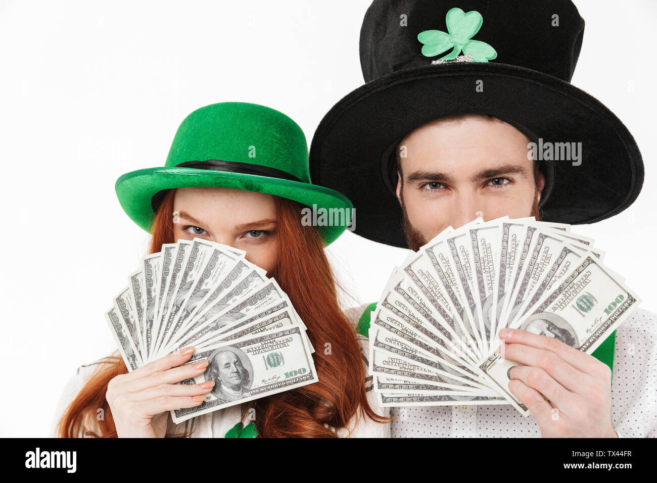 Happy young couple wearing costumes, celebrating St.Patrick 's Day ...