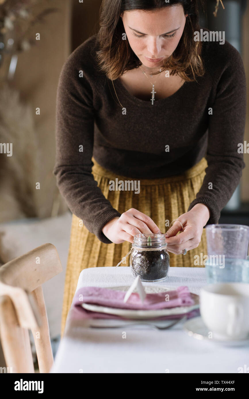 Woman bending over table hi-res stock photography and images - Alamy