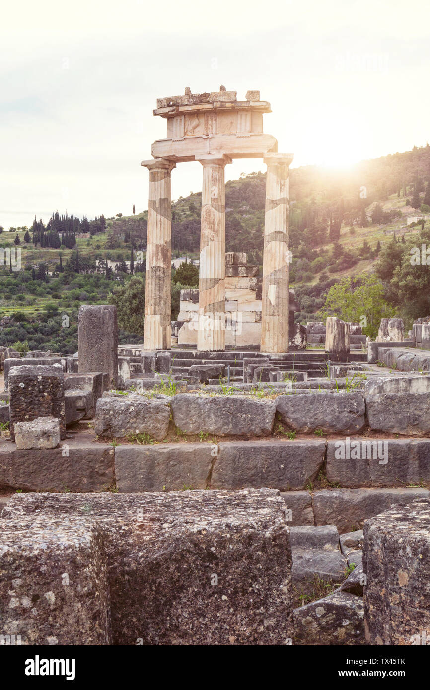 Greece, Delphi, tholos in the sanctuary of Athena Pronaia at sunset ...