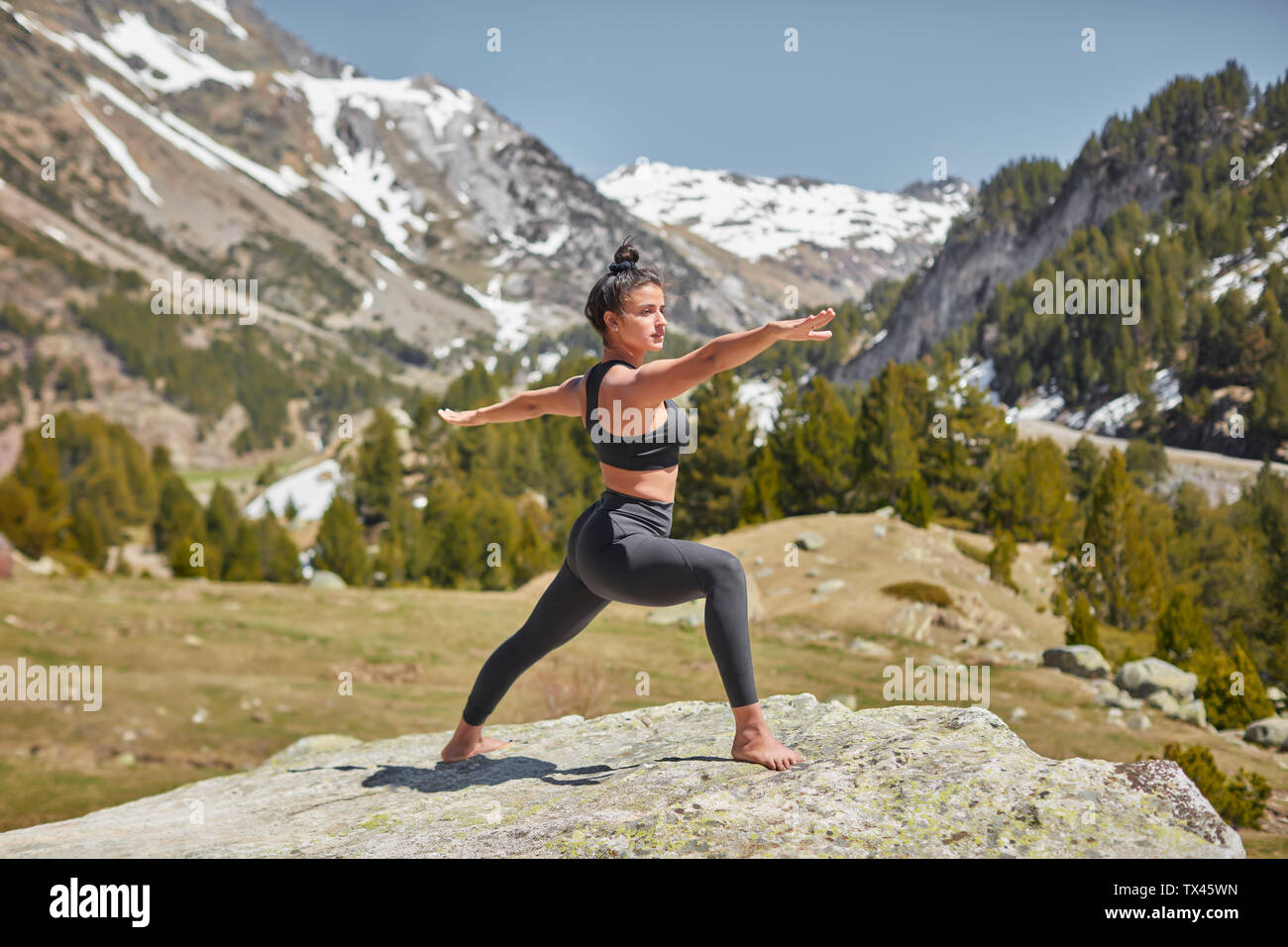 Woman warrior pose on mountain hi-res stock photography and images - Alamy