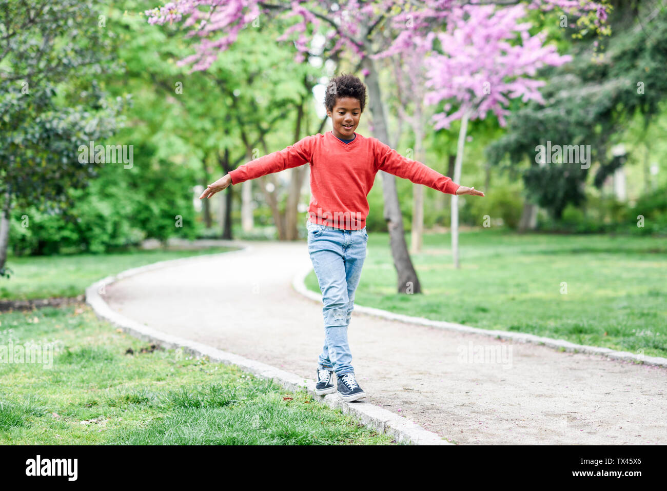 Boy balancing full length hi-res stock photography and images - Alamy