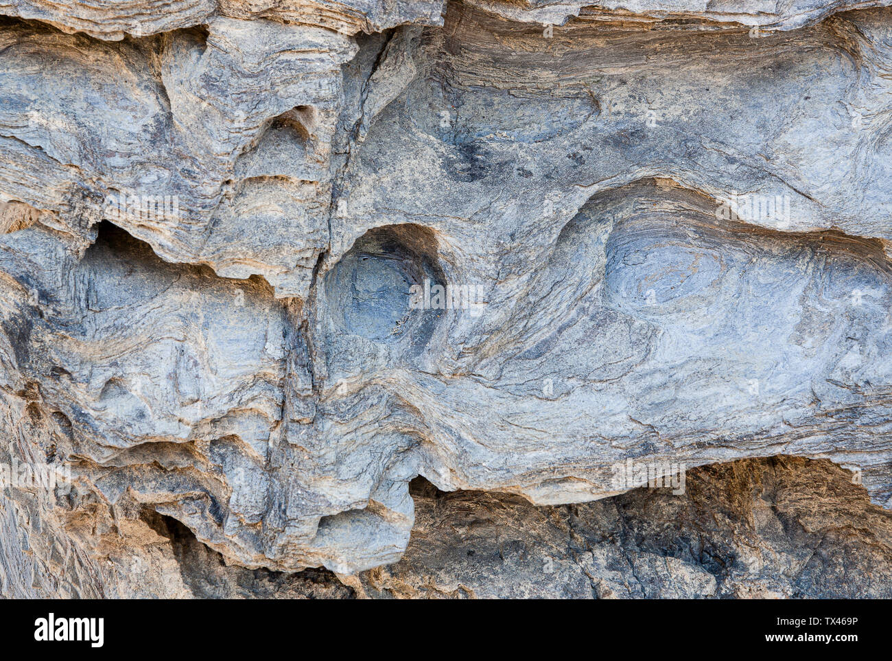 Rock carved by the forces of the waves of the sea, where you can see ...
