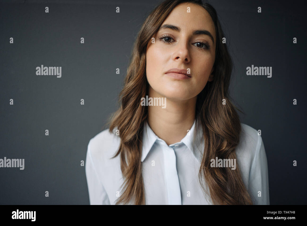 Serious young businesswoman hi-res stock photography and images - Alamy