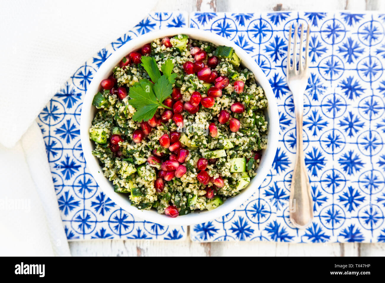 Bulgur herbs tabbouleh with pomegranate seeds Stock Photo - Alamy