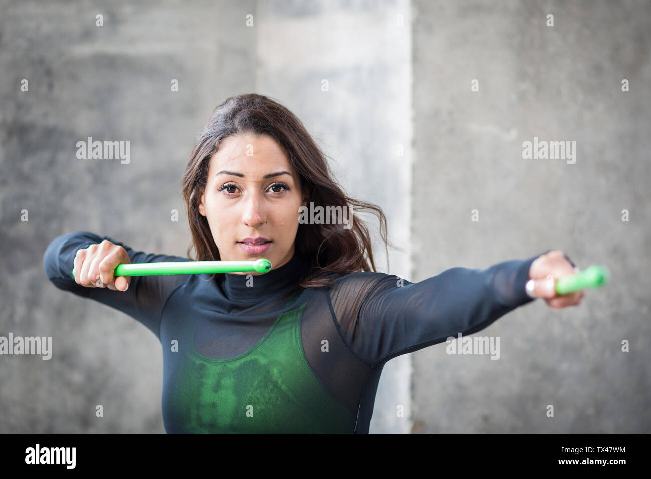 Portrait of young woman doing pound fitness exercise Stock Photo - Alamy