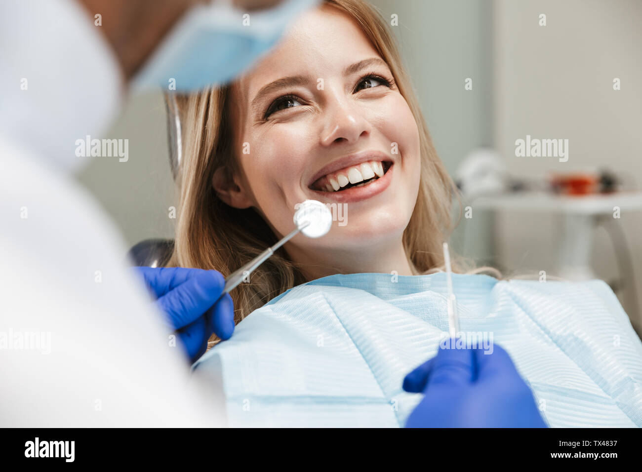 Image Of Pretty Young Woman Sitting In Dental Chair At Medical Center