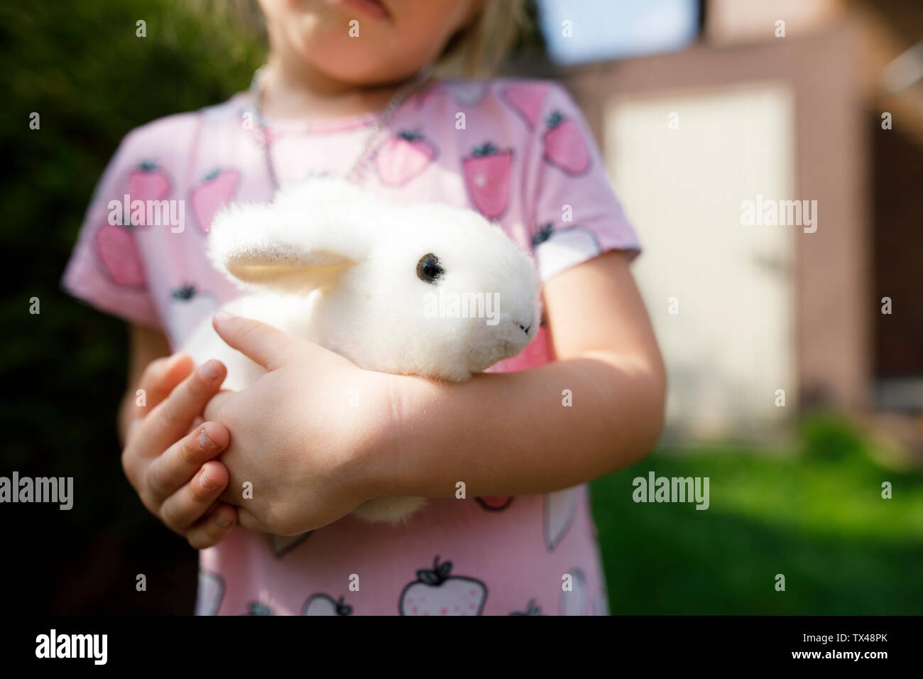 Girl Holding Bunny High Resolution Stock Photography and Images - Alamy