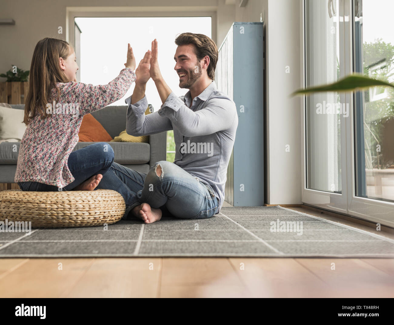 Parents high five child hi-res stock photography and images - Alamy