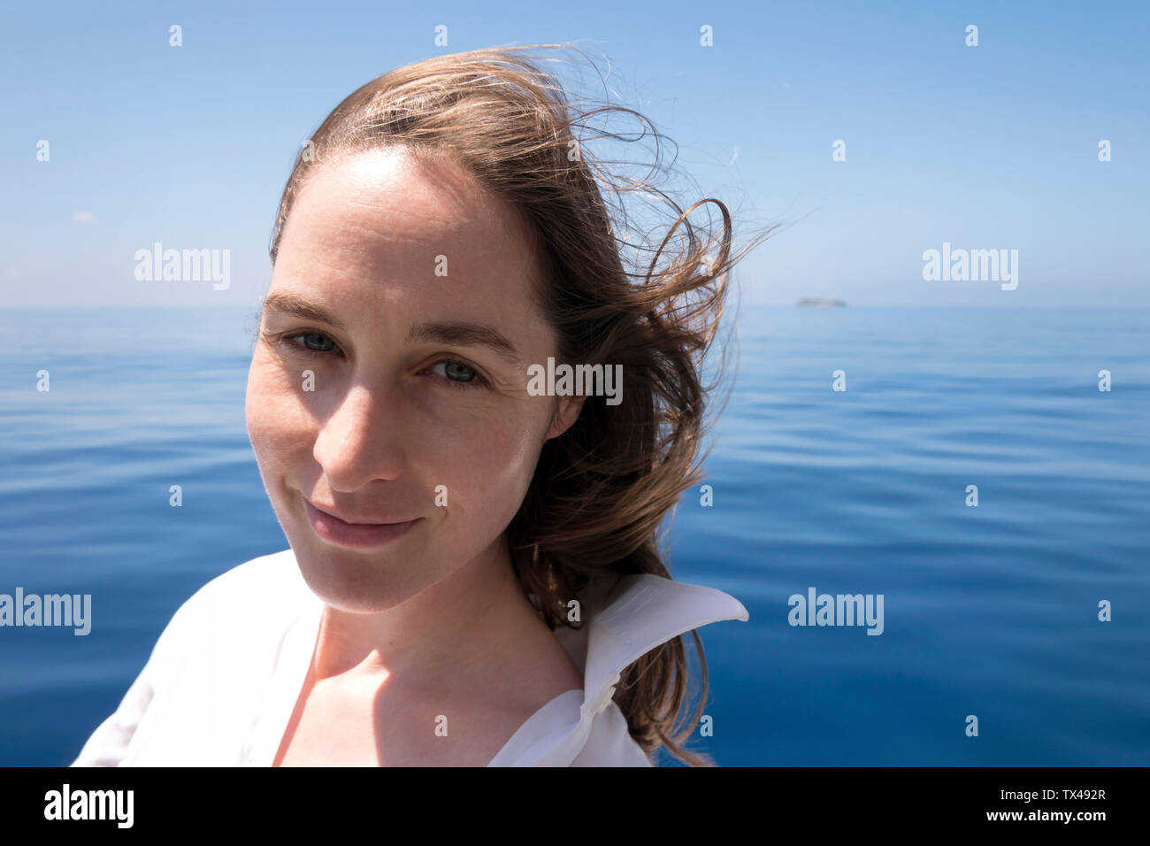 Seychelles, Indian Ocean, portrait of smiling woman on ferry Stock ...