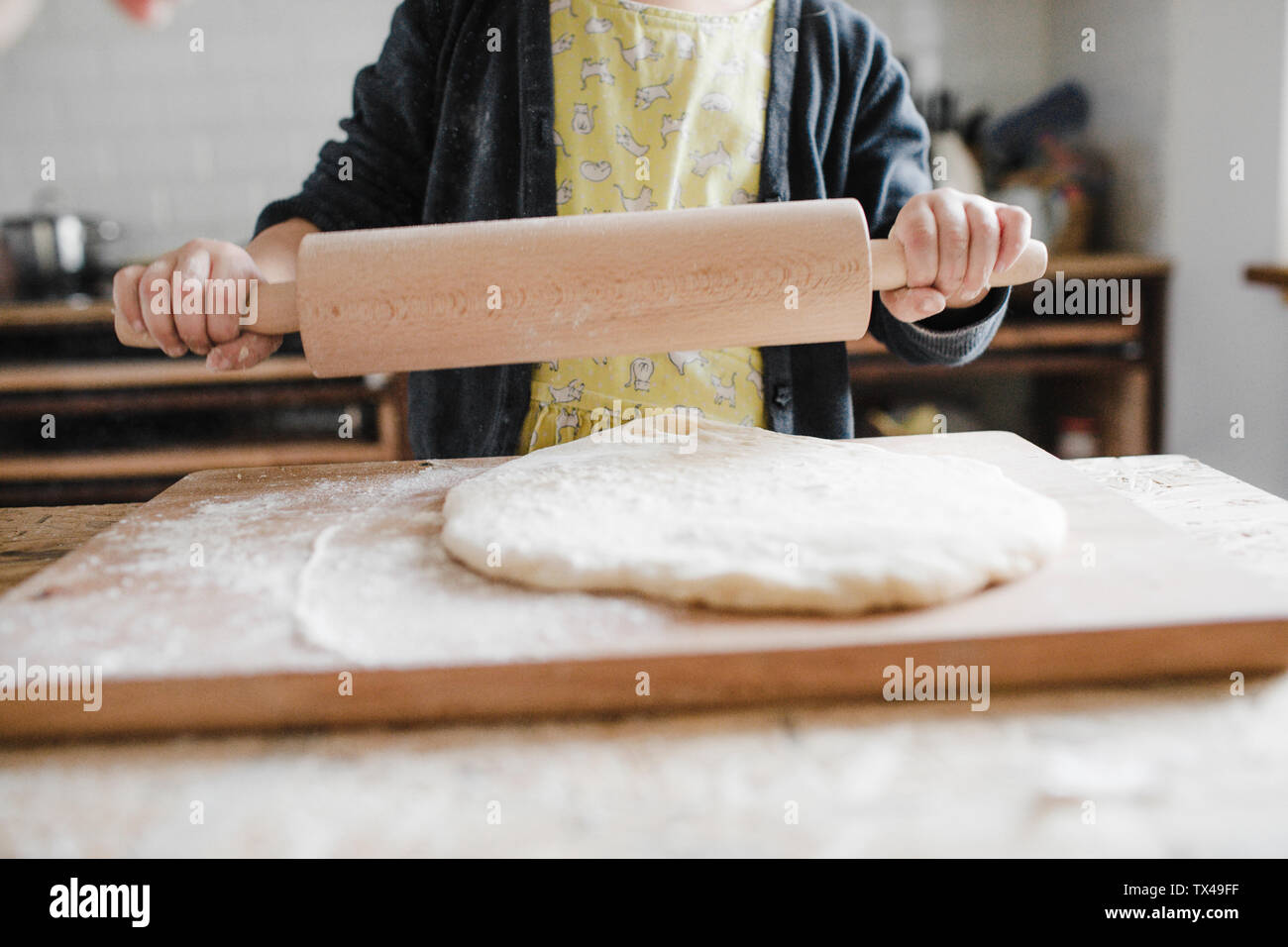 Girls hands holding rolling pin in the kitchen hi-res stock photography ...