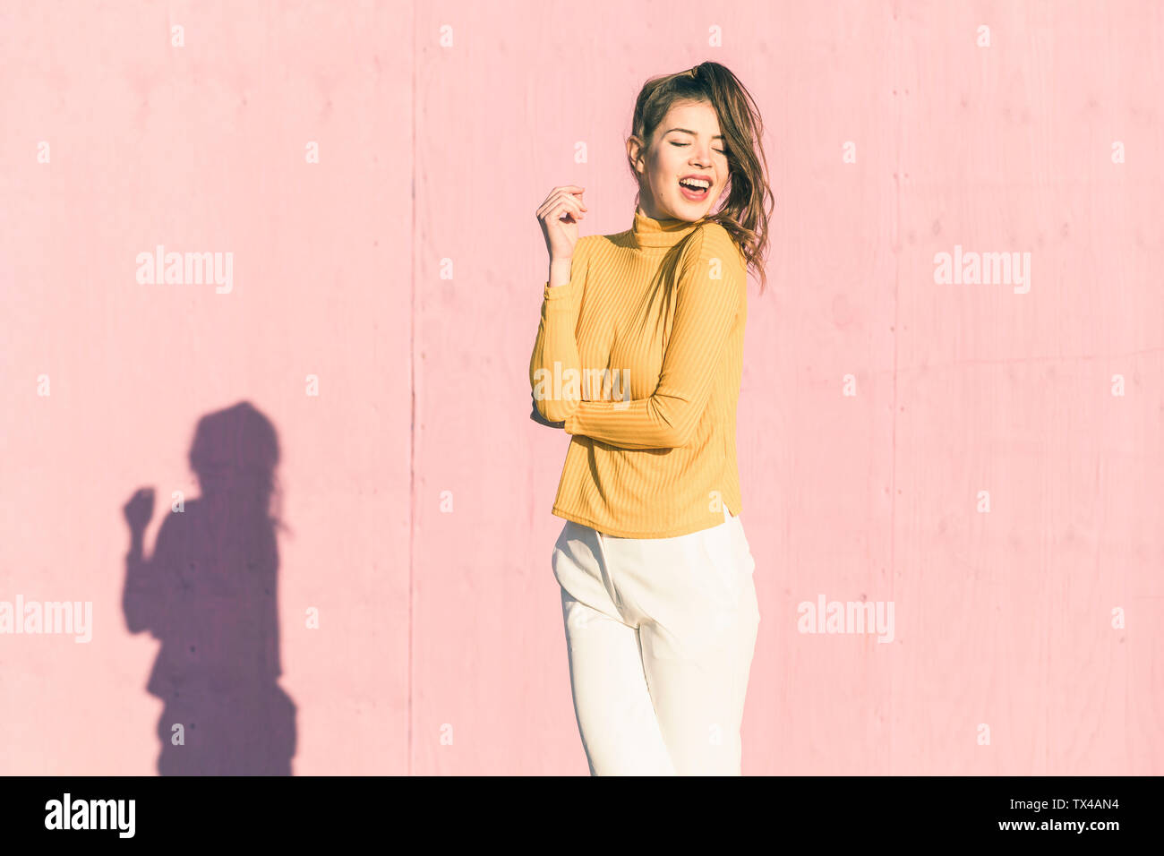 Joyful singing young woman hi-res stock photography and images - Alamy