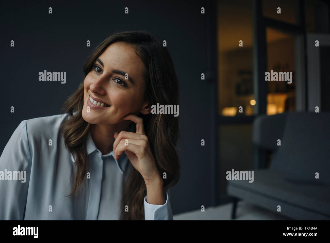 Portrait of smiling young businesswoman looking sideways Stock Photo ...