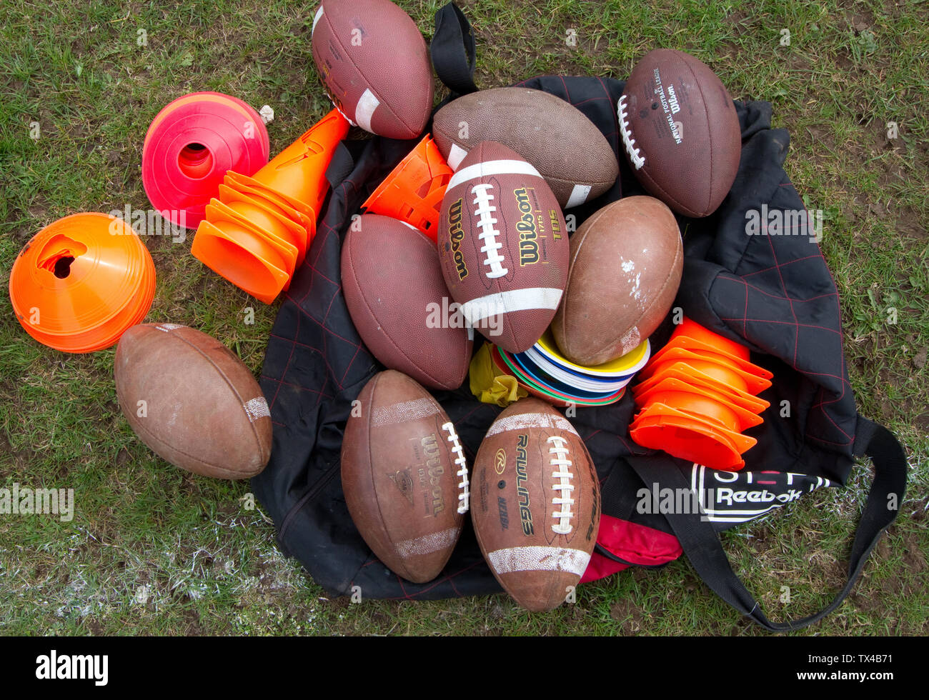 American footballs pile hi-res stock photography and images - Alamy
