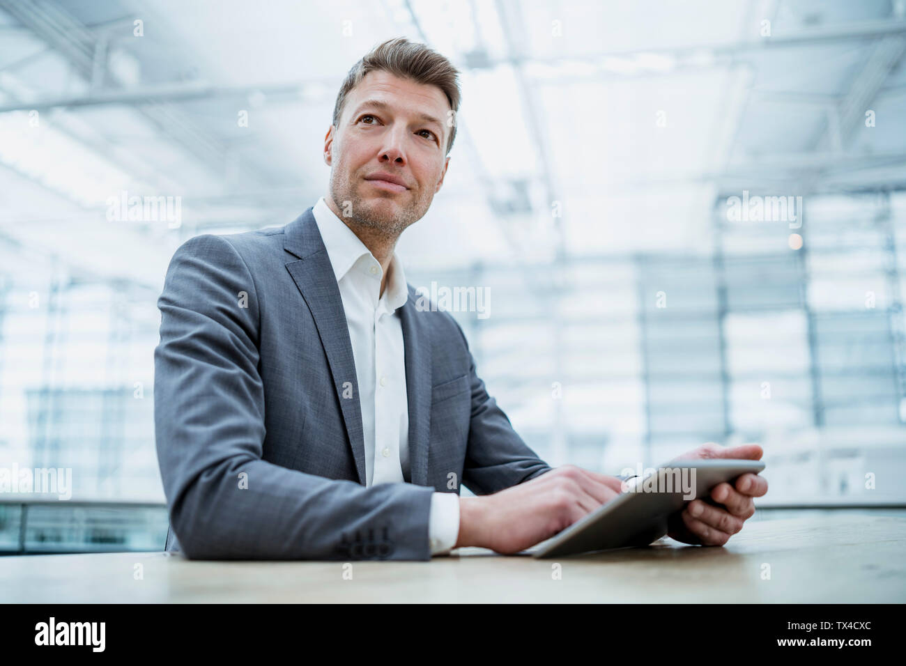 Using at the table hi-res stock photography and images - Alamy