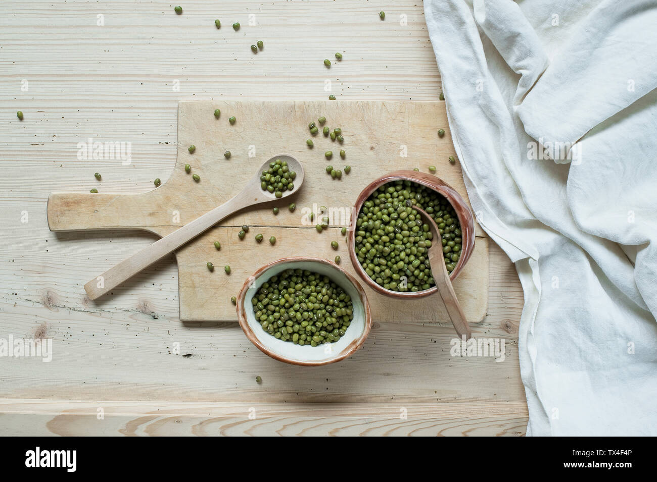 Split beans on wooden background Stock Photo - Alamy