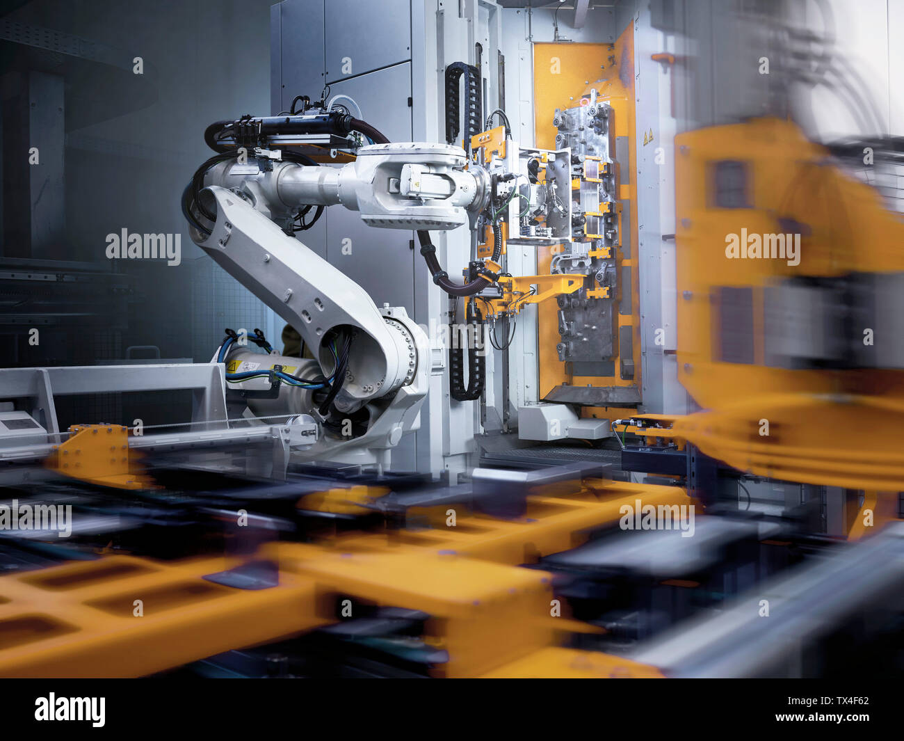 Industrial robot in modern factory Stock Photo - Alamy