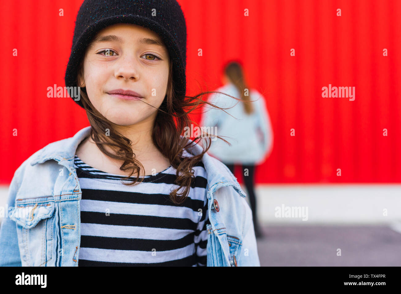 Portrait of little girl wearing black cap Stock Photo - Alamy
