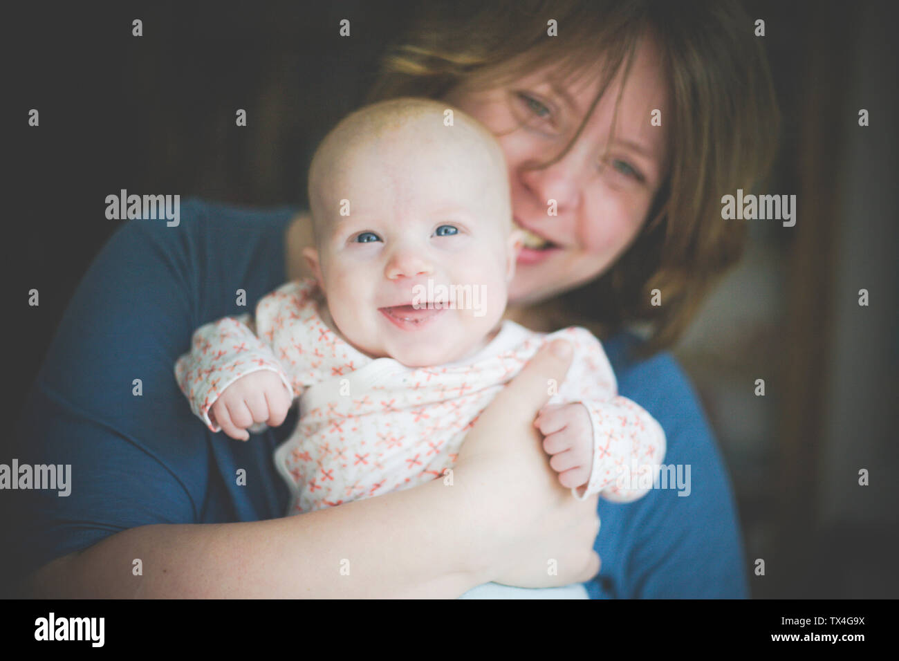 Portrait happy mother carrying hi-res stock photography and images - Alamy
