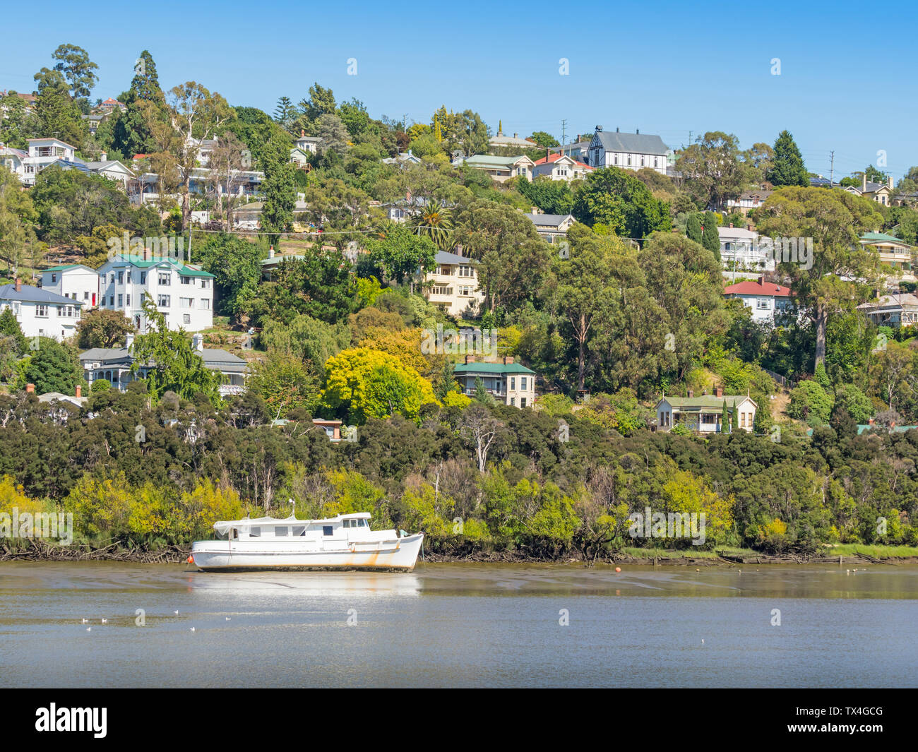 A boat grounded in the Tamar River in Launceston, in Tasmania ...