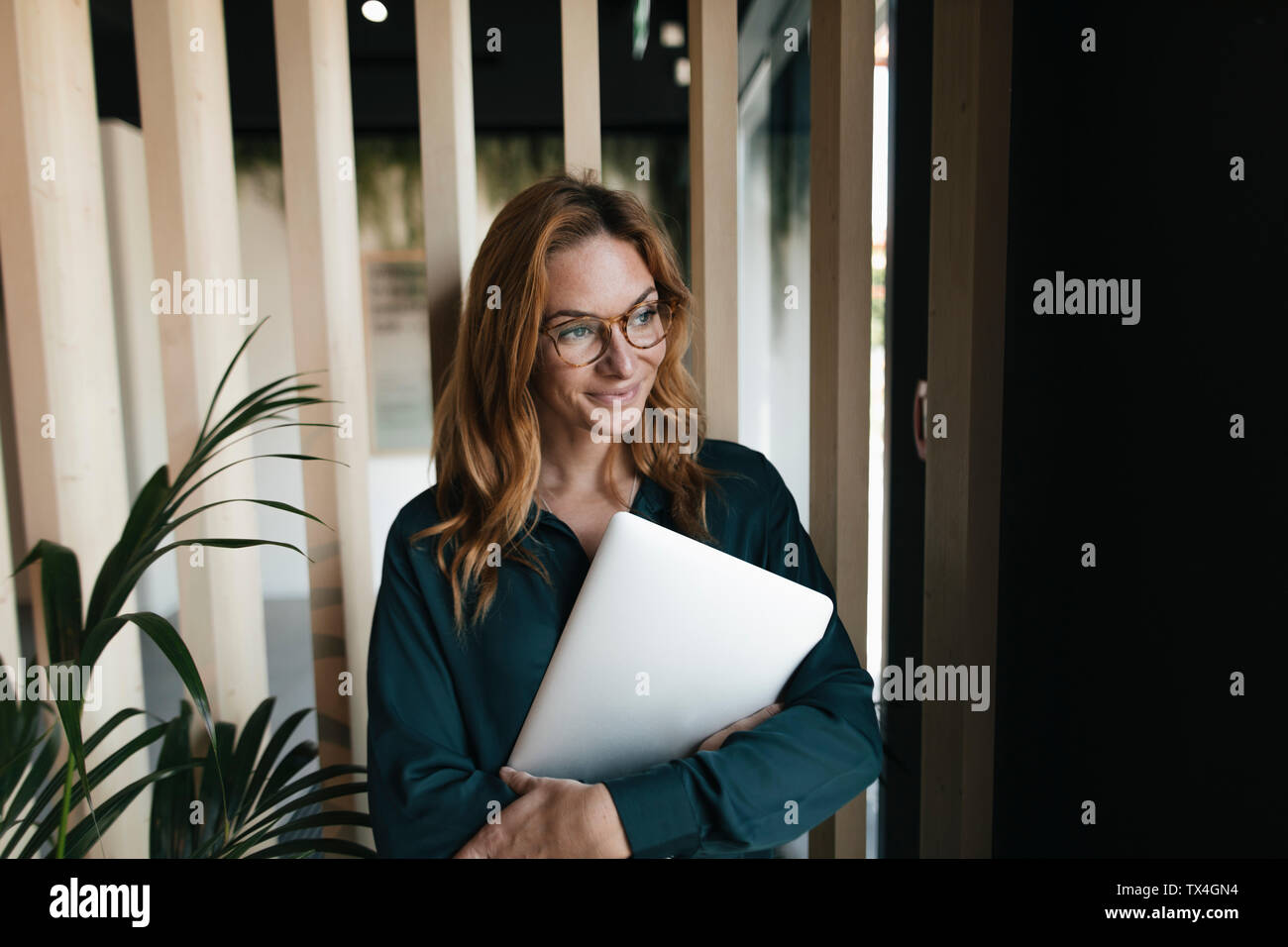 Holding sideways hi-res stock photography and images - Alamy