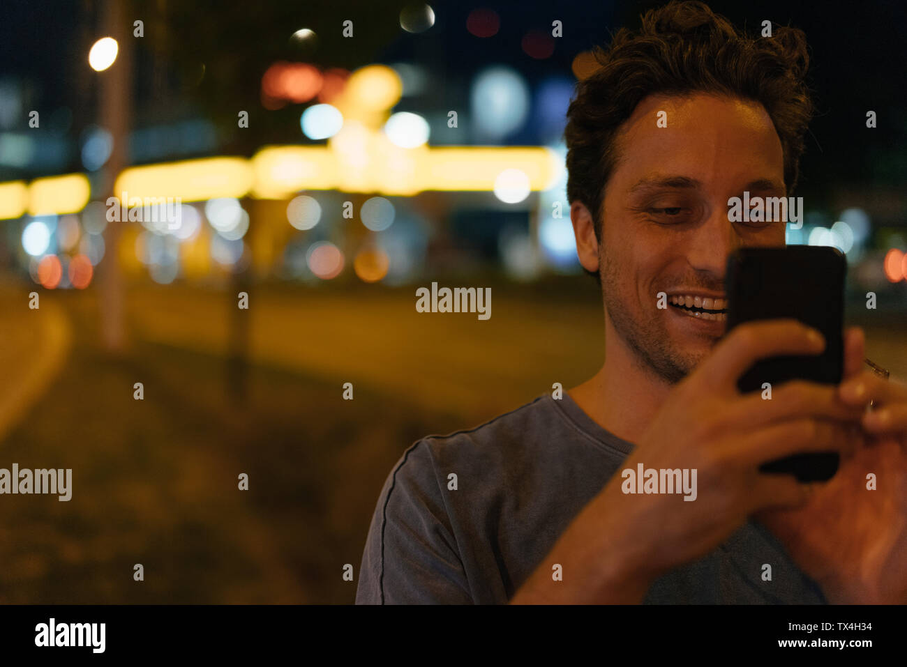 Happy Man Looking Phone Night High Resolution Stock Photography and ...