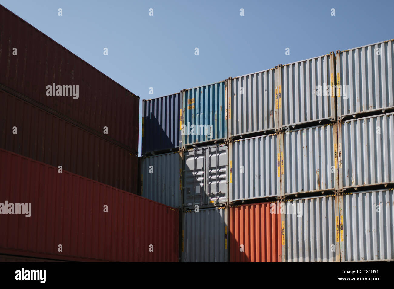 Stack of containers on industrial site Stock Photo - Alamy