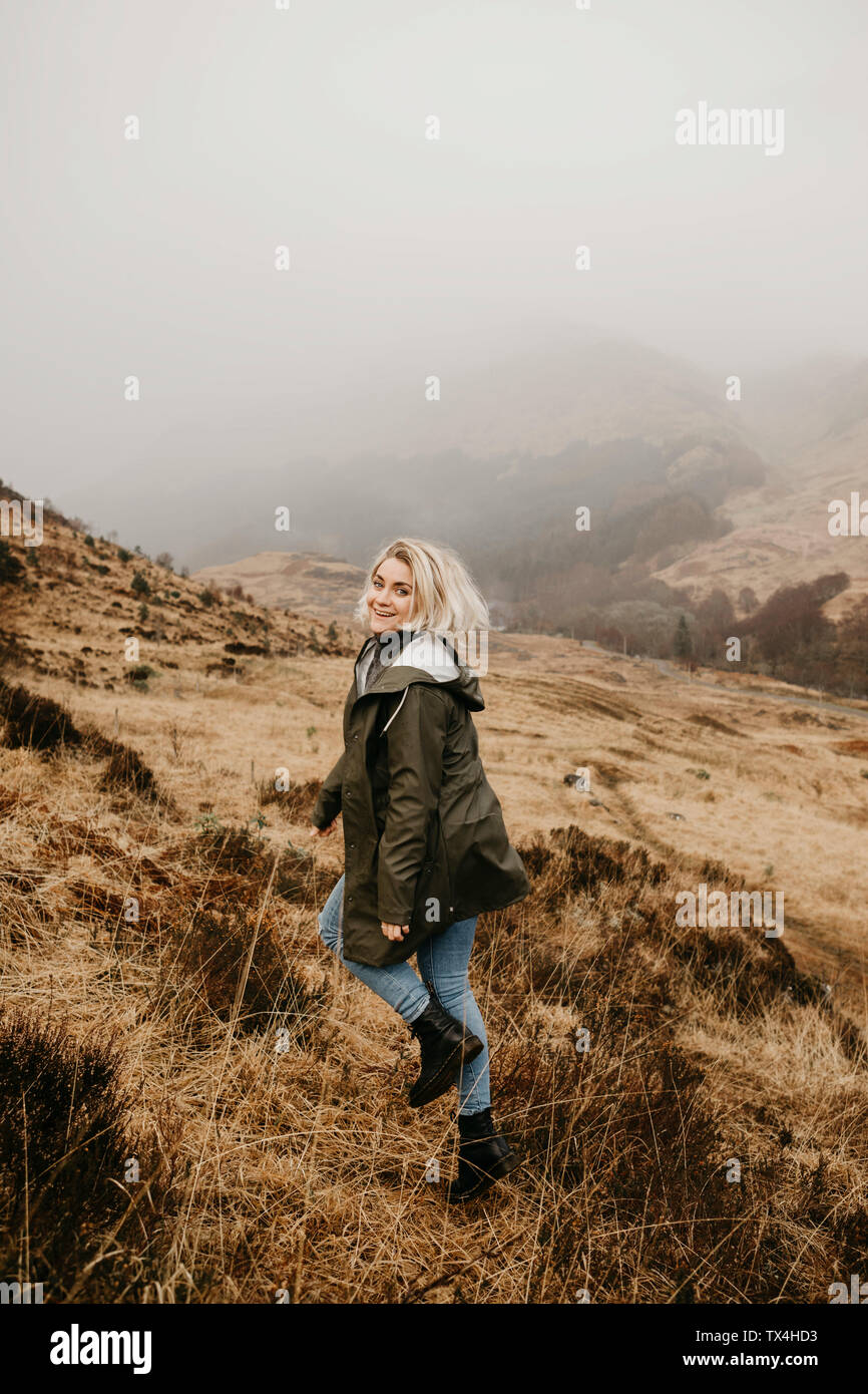 Woman enjoying the weather in scotland hi-res stock photography and ...
