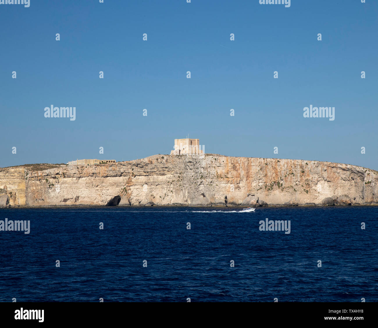 The island of Comino in the Gozo Channel with its medieval watchtower ...