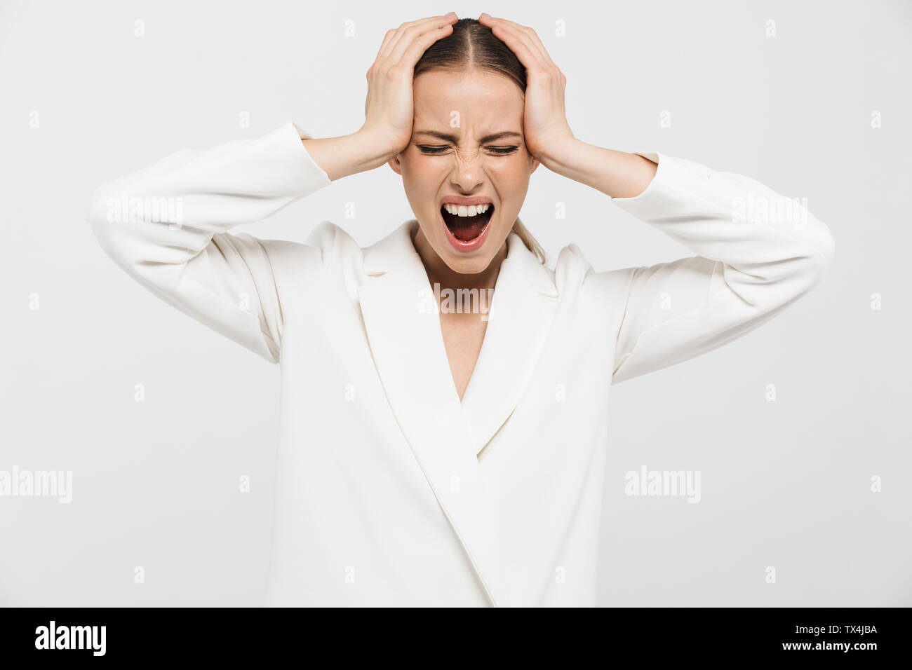 Image of a beautiful emotional screaming woman posing isolated over ...