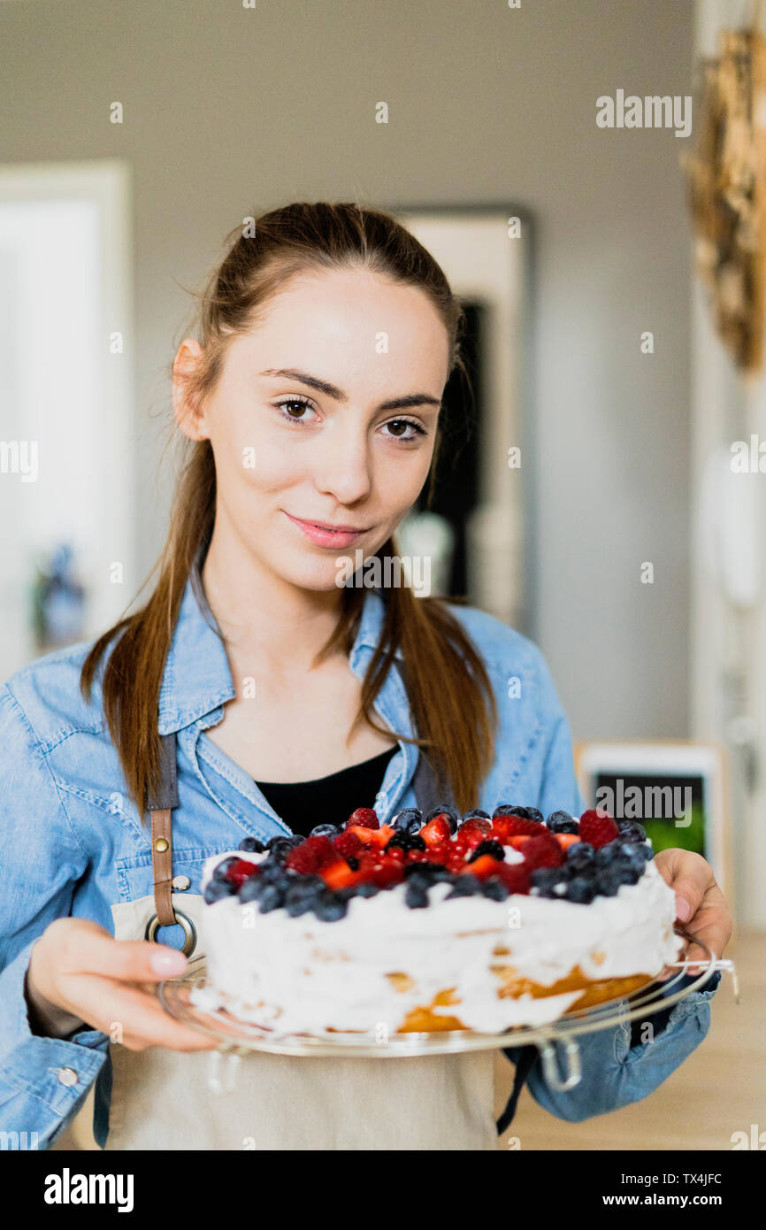 Woman holding cake with apron hi-res stock photography and images - Alamy