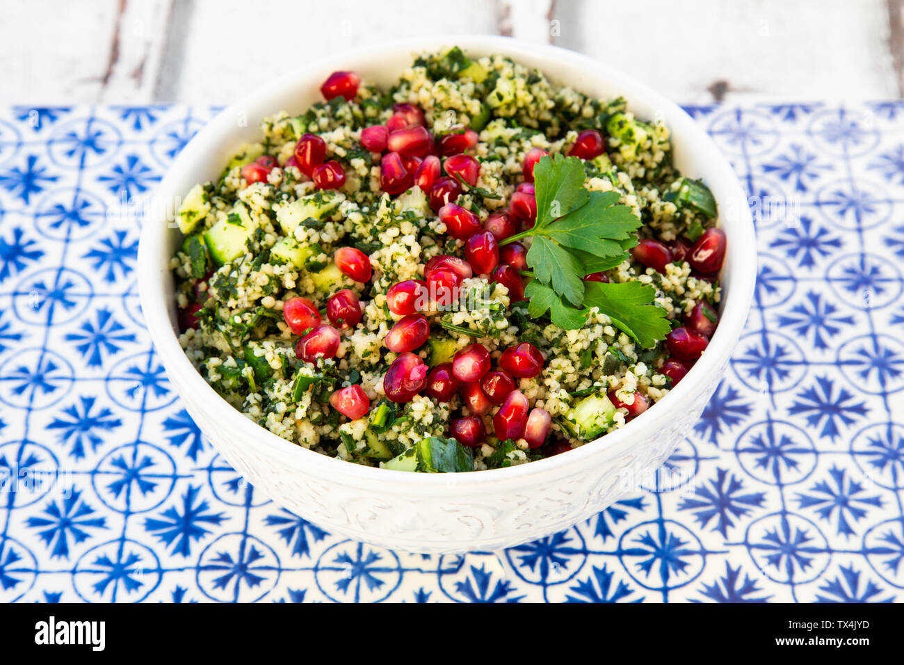 Bulgur herbs tabbouleh with pomegranate seeds Stock Photo - Alamy