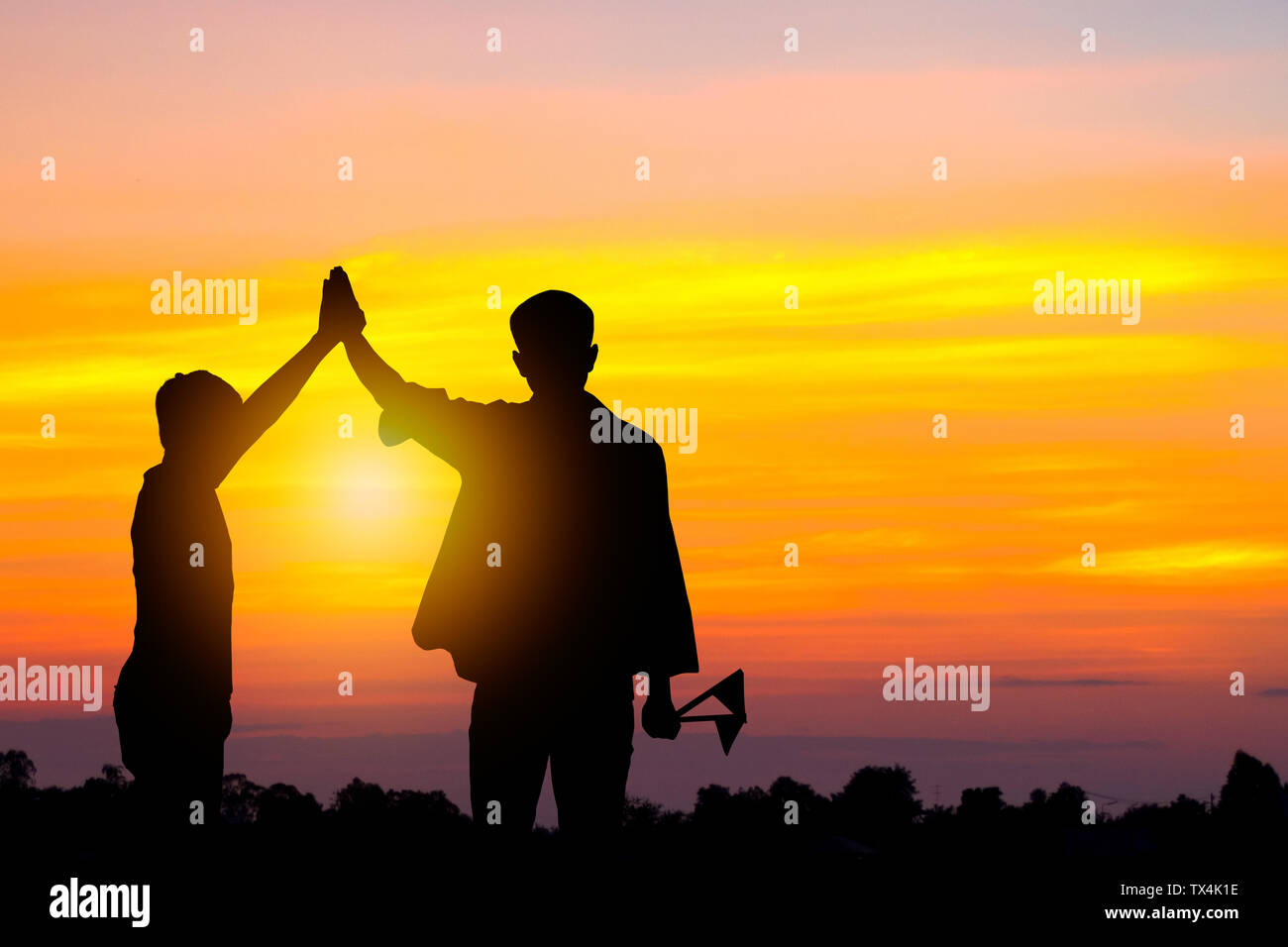Success ans achievement concept, Silhouette of men holding two flag in ...