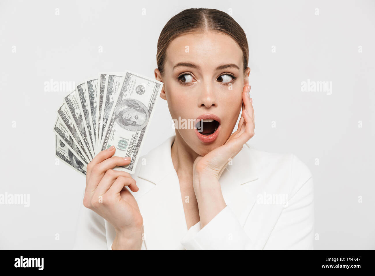 Photo of rich businesswoman 20s wearing elegant jacket holding fan with ...