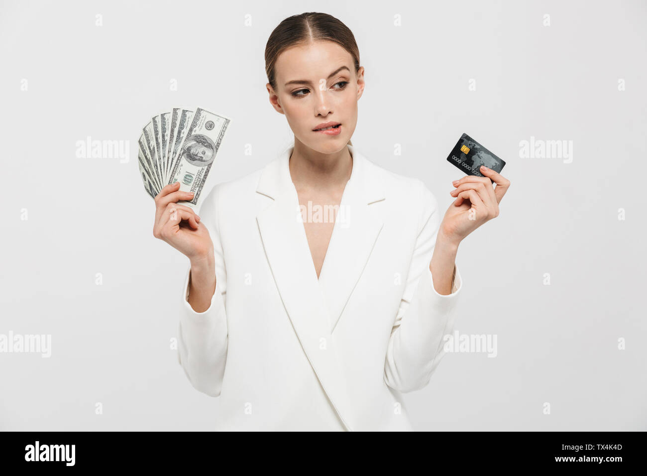 Photo of lucky businesswoman 20s wearing elegant jacket holding fan ...