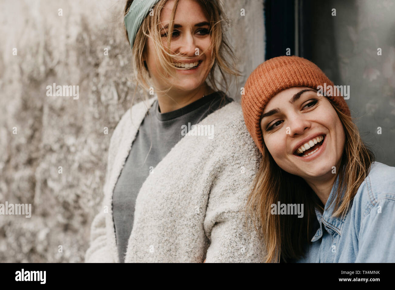UK, Scotland, two laughing young women at a building Stock Photo - Alamy
