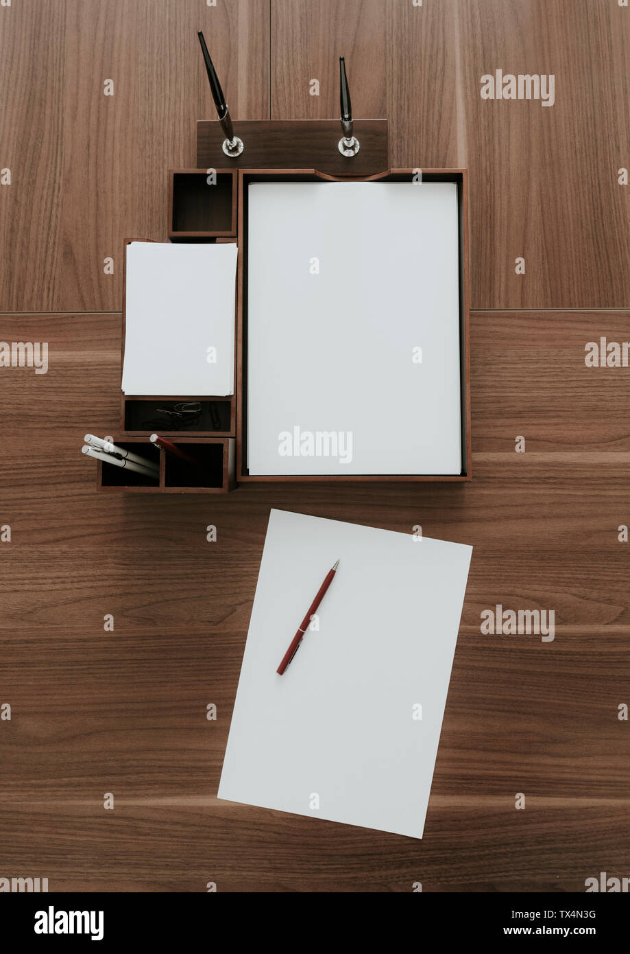 Top view of neat wooden desk in office Stock Photo - Alamy