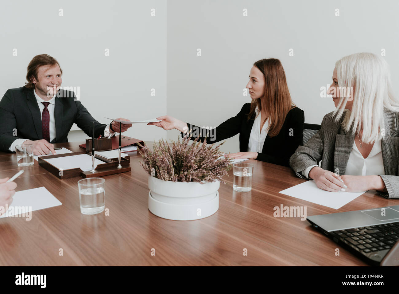 Businessman handing over documents hi-res stock photography and images ...