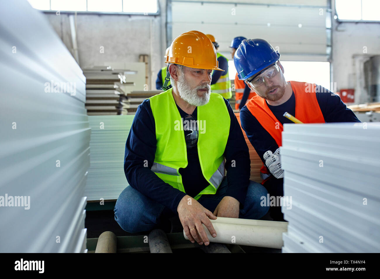 Men working together hi-res stock photography and images - Alamy
