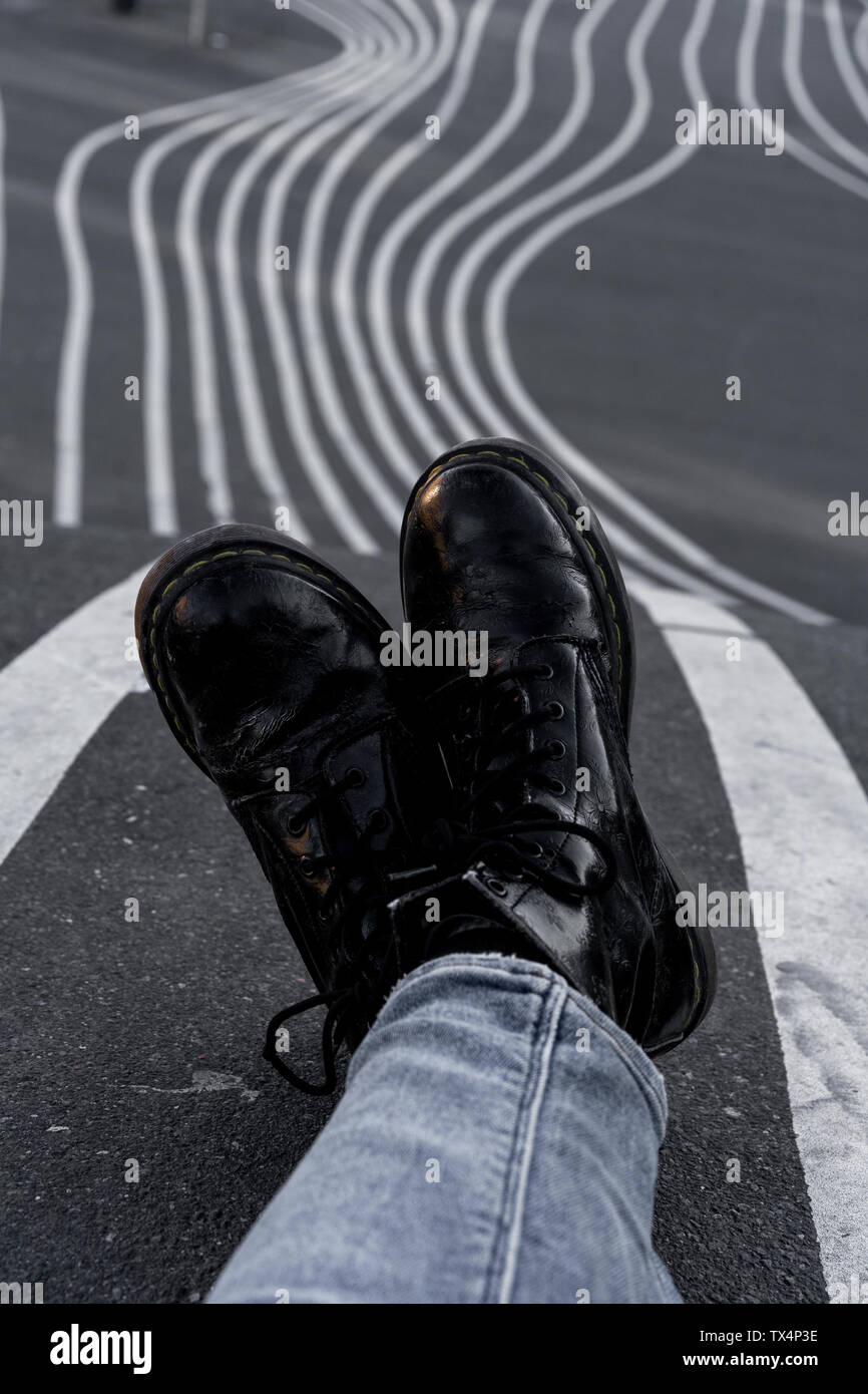 Denmark, Copenhagen, woman's black boots on tarmac Stock Photo - Alamy