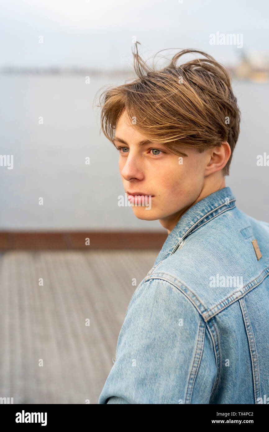 Denmark, Copenhagen, portrait of young man at the waterfront Stock ...