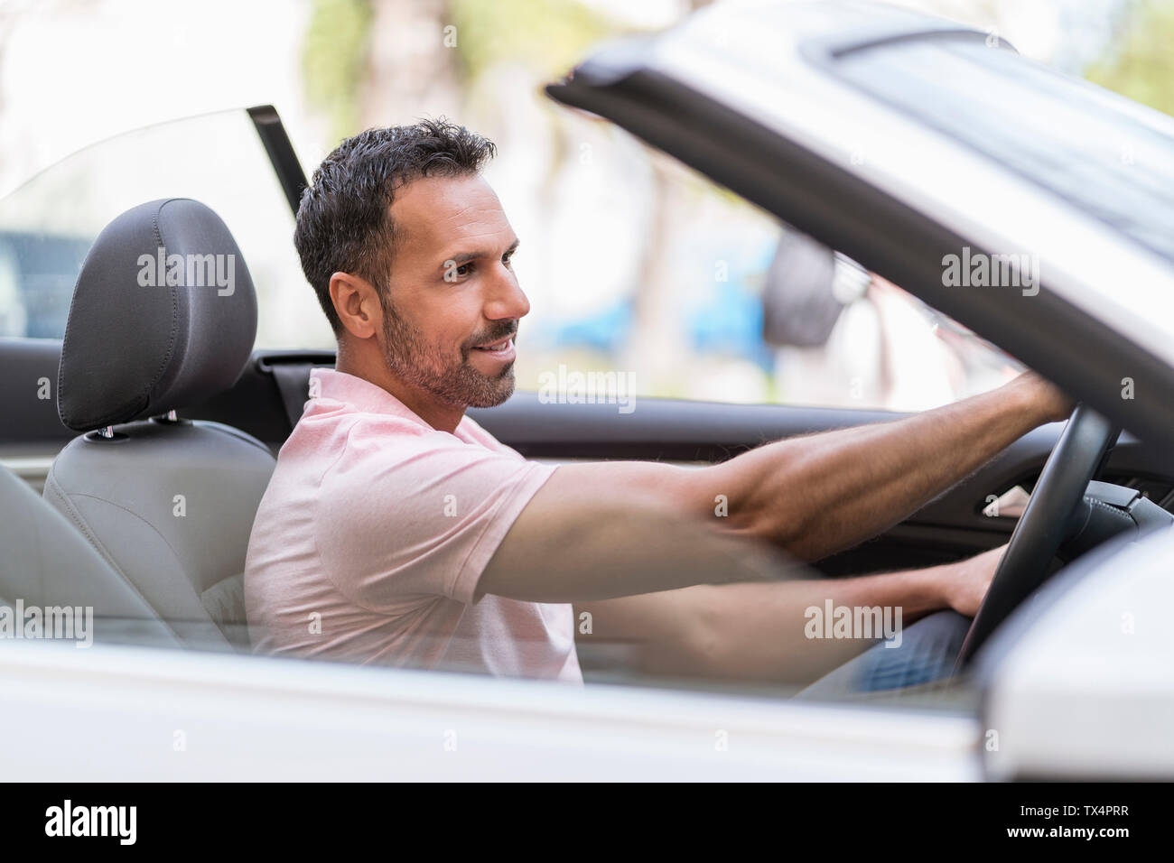 Mid adult man driving hi-res stock photography and images - Alamy
