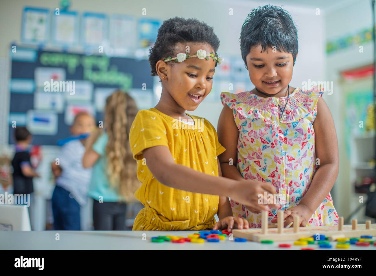 Two children playing game hi-res stock photography and images - Alamy